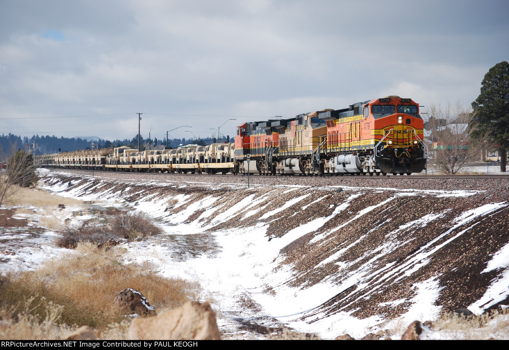 BNSF 4779 leads a US Army War Machine Train eastbound carrying HUM V's and M1A2 Abram Tanks ...